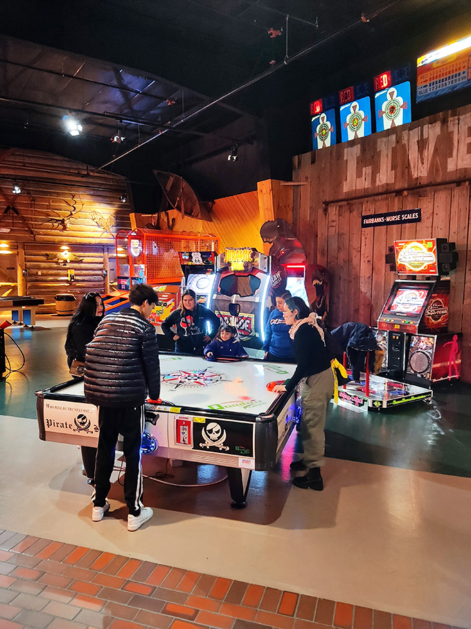 The arcade offers a welcome respite for shopping-weary family members, where air hockey battles determine who gets to choose the next store.