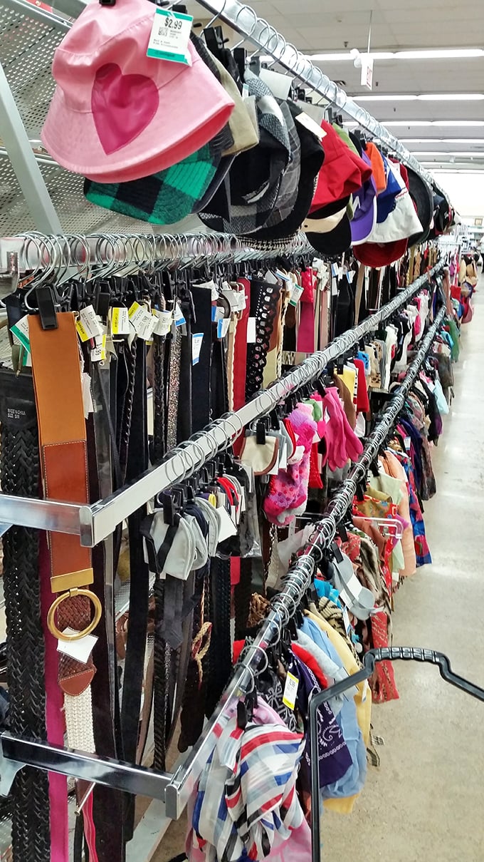 The accessories wall &ndash; where fashion statements of decades past hang in suspended animation. That pink bucket hat is just waiting for its Y2K revival moment.
