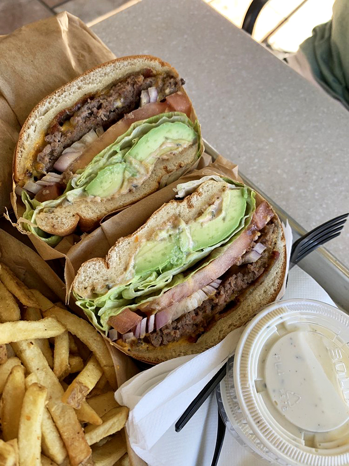 The Avocado & Bacon Cheeseburger: California's unofficial state sandwich, where creamy green gold meets crispy bacon in burger paradise.