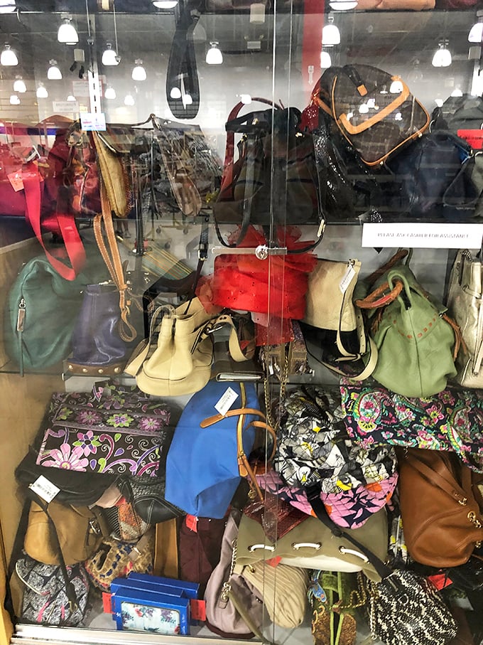 Handbags of every color and pattern huddle together behind glass, from designer names to quirky conversation starters&mdash;all waiting for new shoulders.