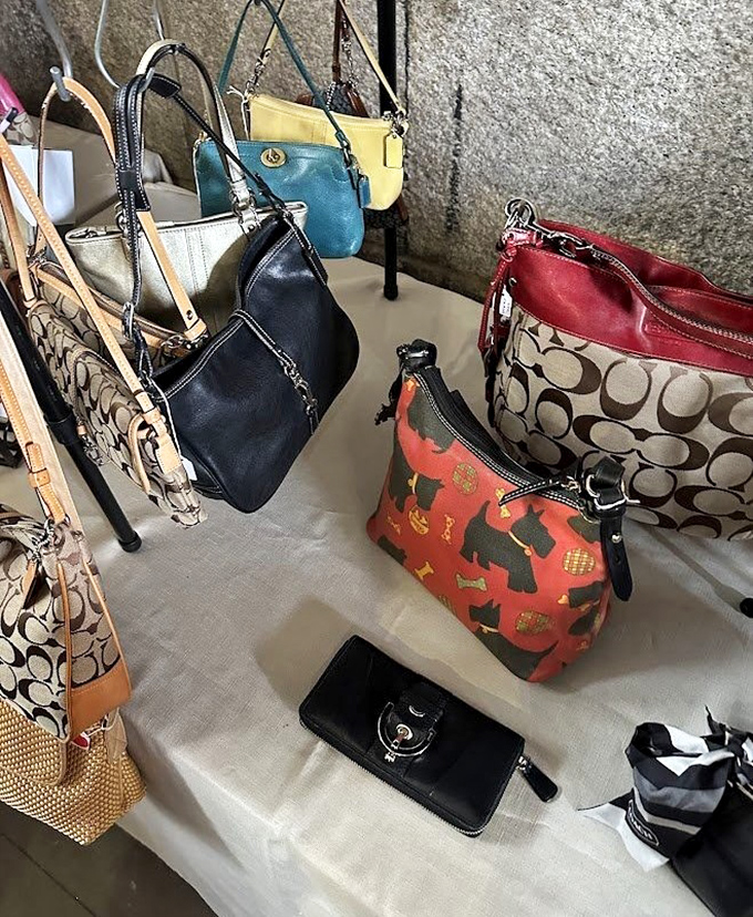 Designer handbags enjoying their second act. That red Coach with the scottie dogs is practically begging for a weekend brunch appearance.