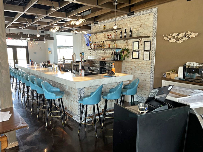 The bar area, with its striking blue chairs and exposed brick, invites you to linger over a glass of Montepulciano while pretending you're in Rome.