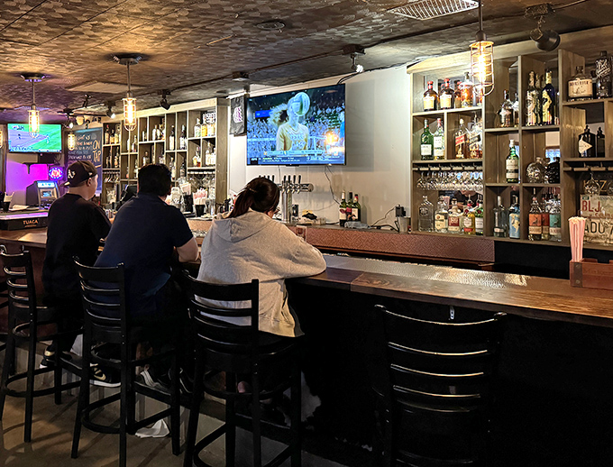 The bar area offers liquid courage for those intimidated by the menu's boldness. Decision-making assistance in glass form.