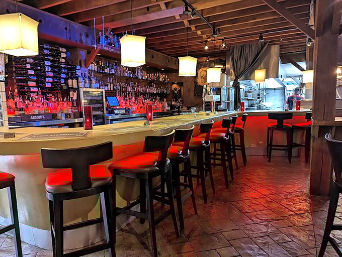 The bar glows with amber promise&mdash;a place where strangers become friends and friends become slightly louder friends.