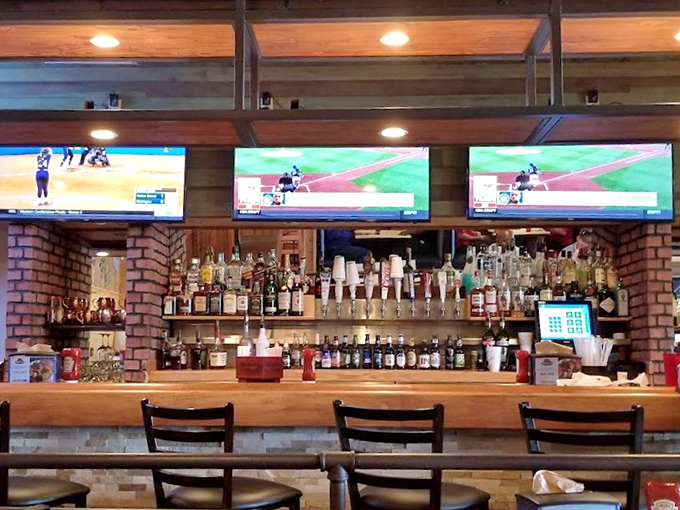 The well-stocked bar area, where sports on TV and spirits on shelves create the perfect backdrop for pre-dinner drinks.