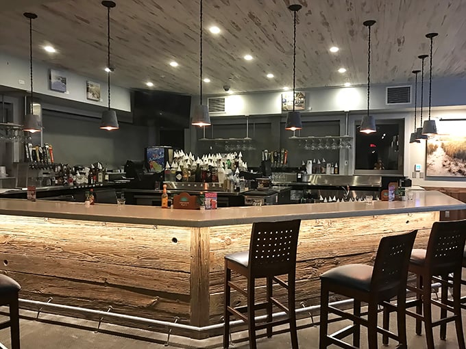 This bar doesn't just serve drinks&mdash;it serves moments. The illuminated wood front glows with promises of vacation stories.