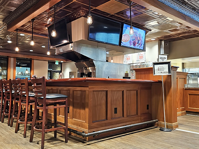 The heart of any great diner &ndash; a well-designed bar area where efficiency meets hospitality under the glow of pendant lights.