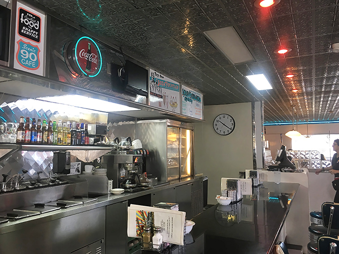 The kitchen's neon glow isn't just illumination&mdash;it's a beacon calling hungry travelers to the promised land of home cooking.