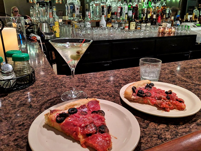 Martinis and pizza slices at the bar &ndash; a pairing that feels both rebellious and absolutely right. The perfect first-date litmus test.