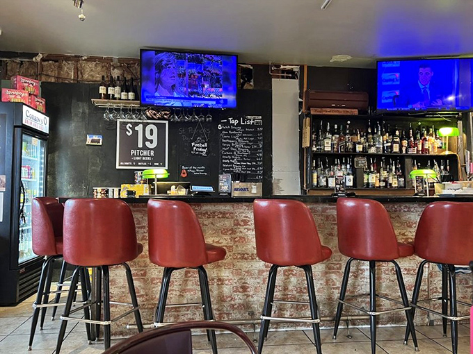 The bar area where craft beer flows freely and the TVs are tuned to whatever game matters today.