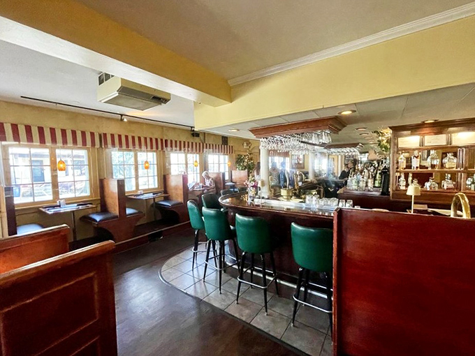 The bar area welcomes you with green stools and warm lighting, the perfect spot to start your Italian culinary adventure.
