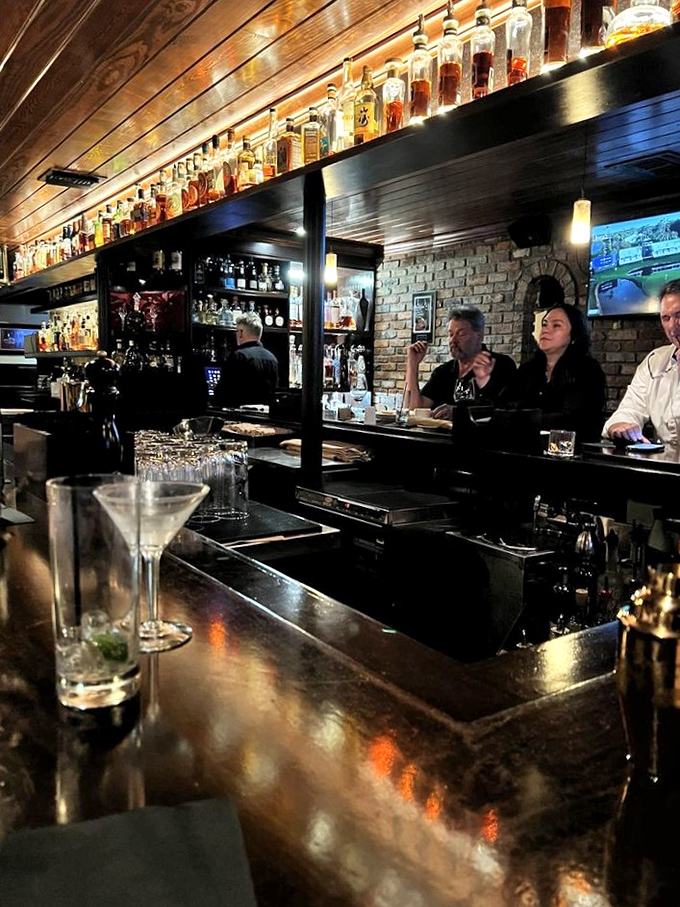 The bar at Okeechobee doesn't just serve drinks&mdash;it dispenses liquid courage and conversation in equal measure under the watchful gaze of premium spirits.