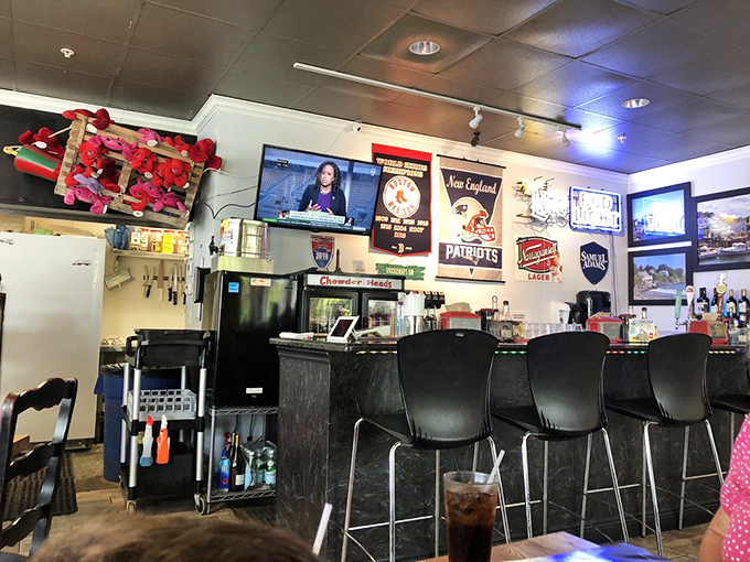 The bar area doubles as a shrine to New England sports teams, where Patriots fans can find solace even in Dolphins territory.
