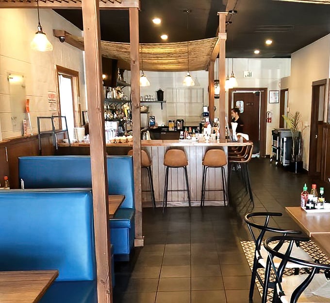 The bar area invites you to pull up a stool and stay awhile, whether you're sipping a craft cocktail or waiting for your takeout treasure.