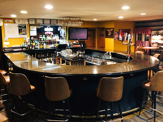 Not just a bar, but a community living room where everyone knows which stool has the best view of both TV and kitchen.