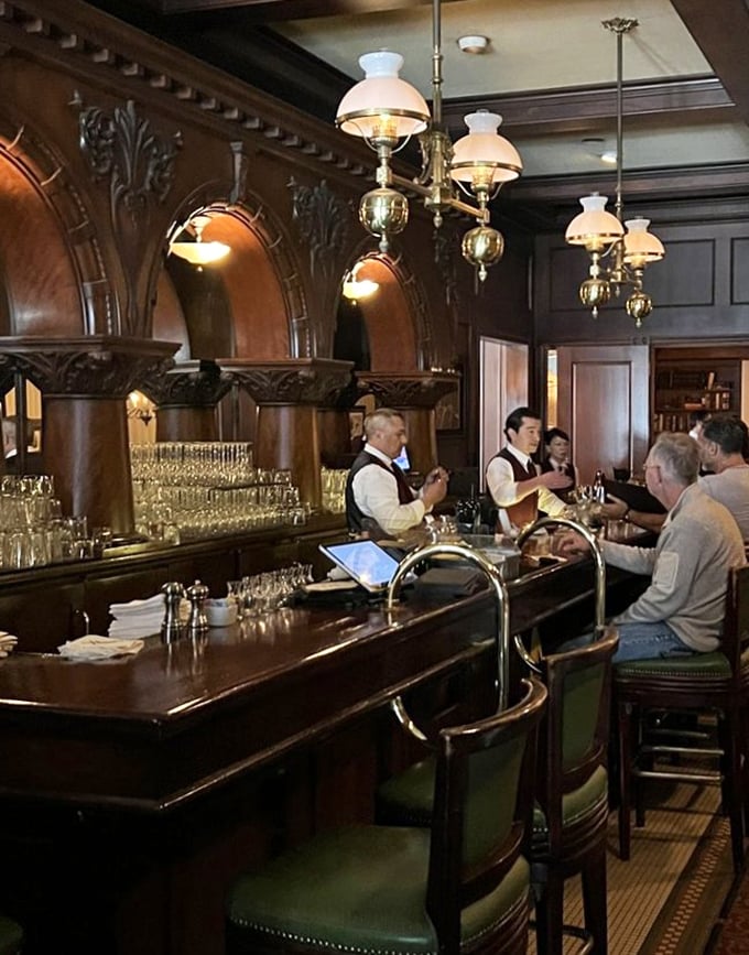 The bar isn't just where drinks are made; it's where stories begin &ndash; polished wood, attentive bartenders, and the promise of perfectly executed classics.