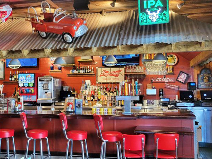 The bar area combines rustic charm with coastal casual&mdash;red stools invite you to belly up for a cold one after a day of Anaheim adventures.