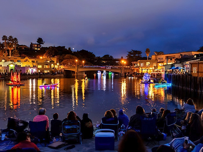 As night falls, Capitola's waterfront glows with floating light displays that turn the harbor into an enchanted liquid canvas.
