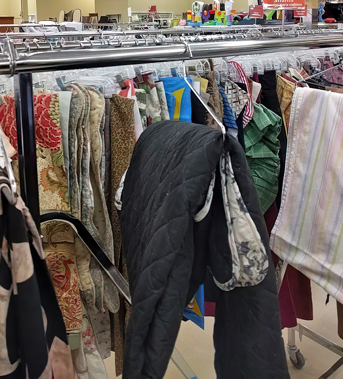 The bedding section: a textile time machine where floral patterns from three decades collide in a surprisingly harmonious fabric symphony.