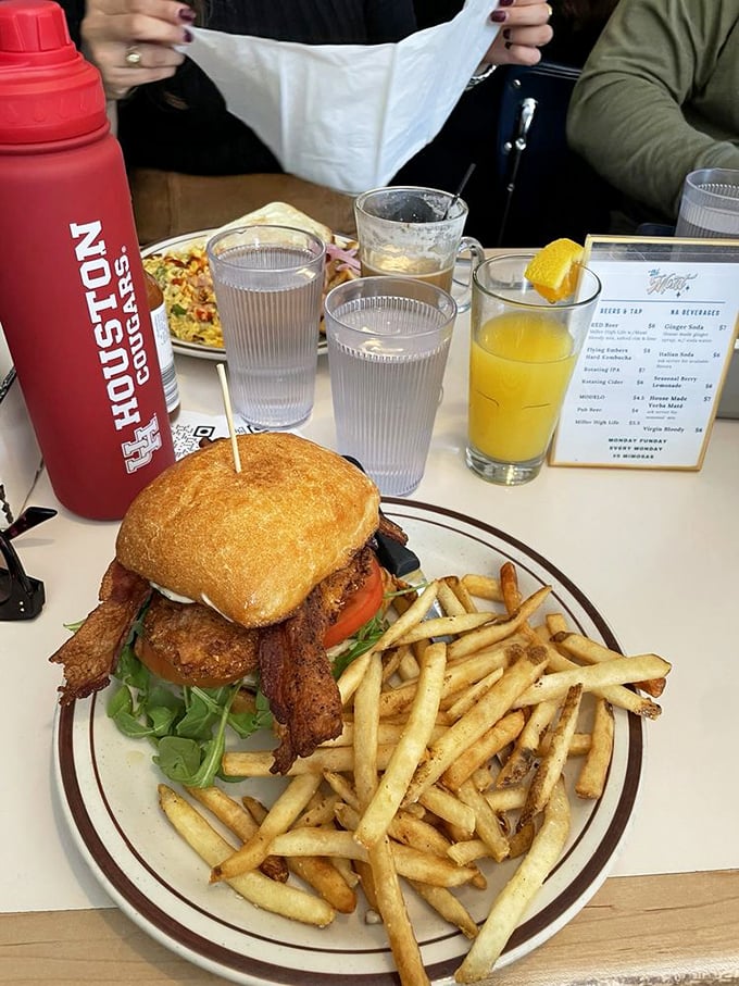 The Belmont chicken sandwich with fries: proof that lunch at a breakfast joint isn't settling&mdash;it's strategic brilliance.