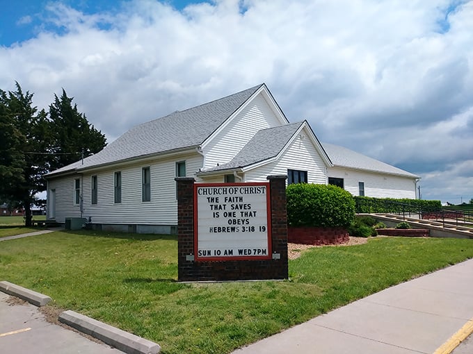 The Church of Christ's message board reminds passersby of Sunday services, a small-town tradition as reliable as the sunrise.