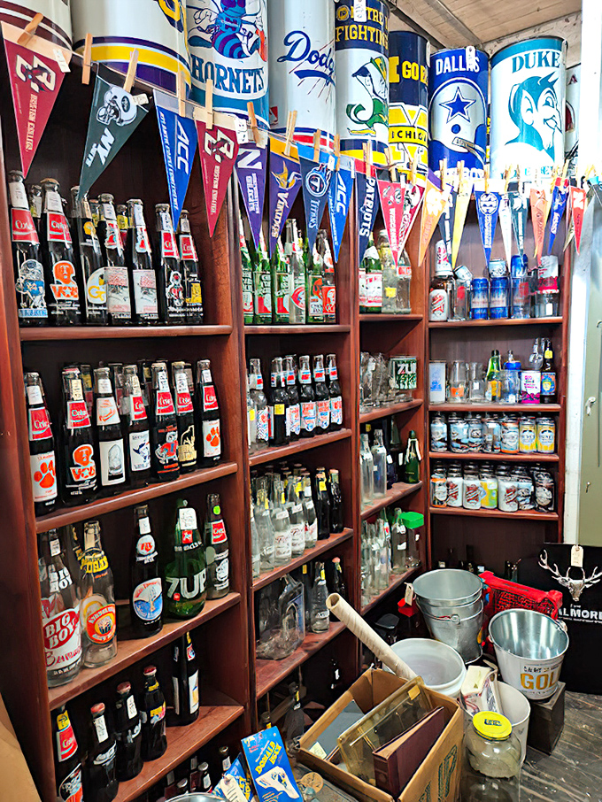 The sports memorabilia corner where team rivalries are preserved in glass bottles. Duke and UNC fans, please maintain a safe distance.