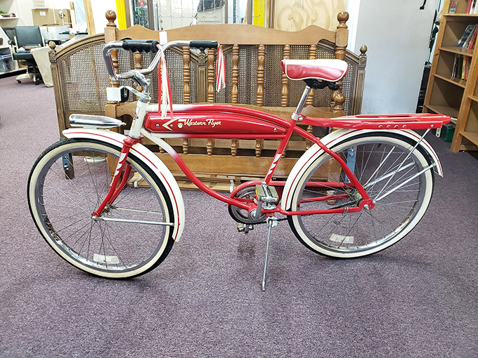 The cherry-red Western Flyer bicycle isn't transportation; it's a time machine to simpler days of soda fountains and paper routes.