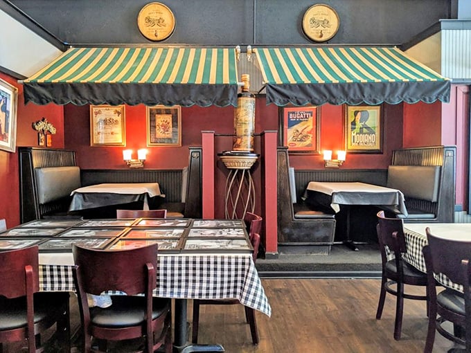 These cozy booths with their green-and-white striped awnings create little neighborhoods within the restaurant &ndash; perfect for intimate conversations or passionate pizza debates.