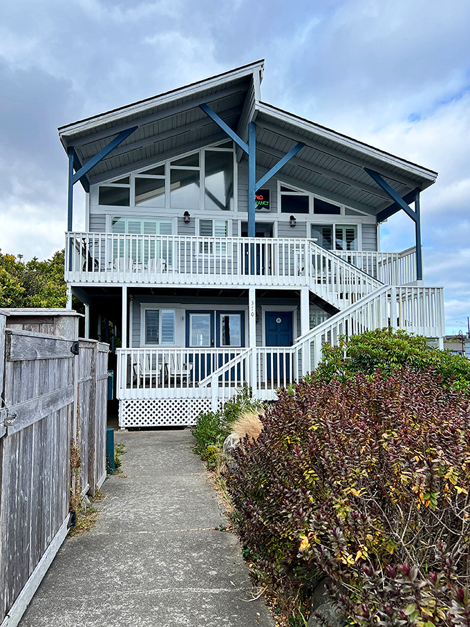 This coastal cottage exemplifies Bandon's architectural charm &ndash; blue accents echoing the ocean and a welcoming porch promising spectacular views.