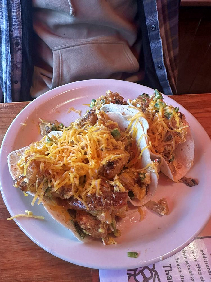 Breakfast tacos that make you question why we don't eat tacos for every meal. Cheese melting over eggs and fillings in a handheld delivery system of joy.