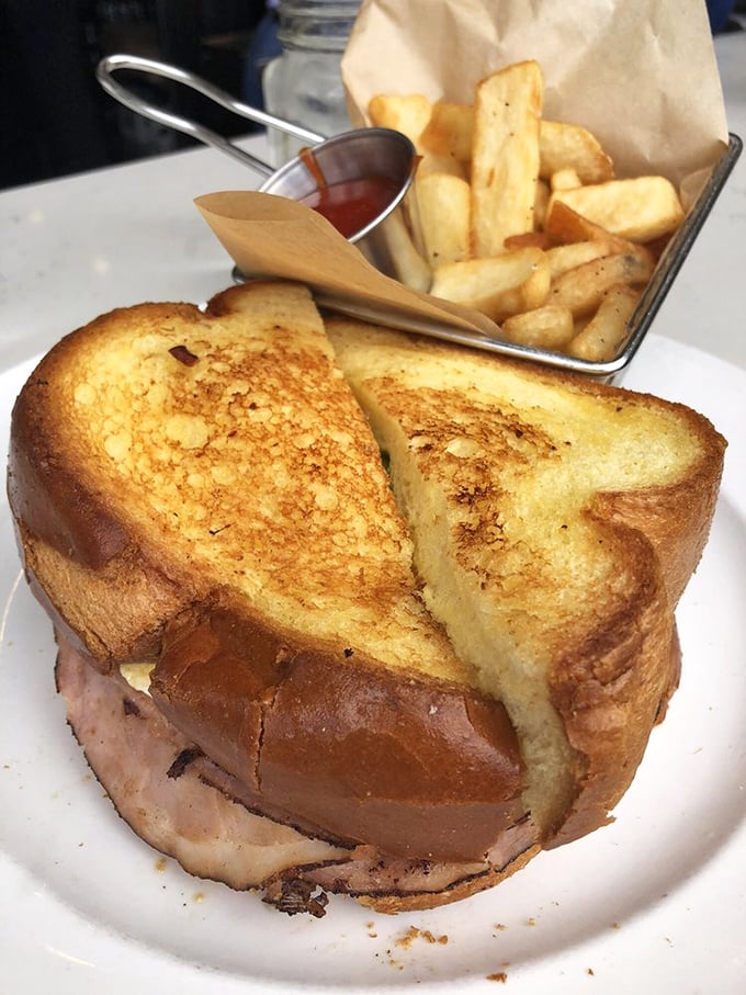 This isn't just a sandwich—it's a golden-grilled love letter to breakfast. That ham is living its best life.