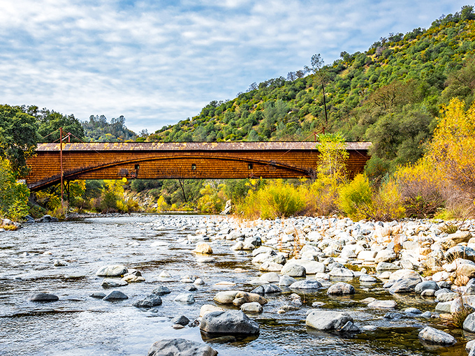 The historic covered bridge spans the South Yuba River, a testament to Gold Rush engineering that now frames perfect Instagram moments.