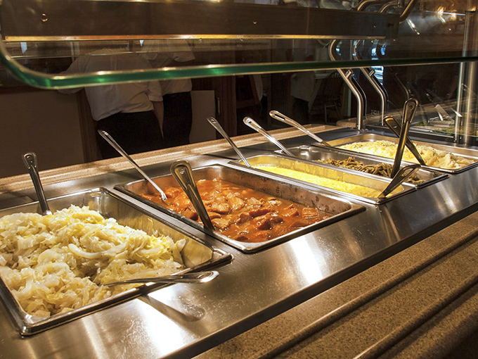 The buffet line—where decision anxiety meets opportunity. Each steaming tray offers a chance to right the wrongs of your last buffet experience.