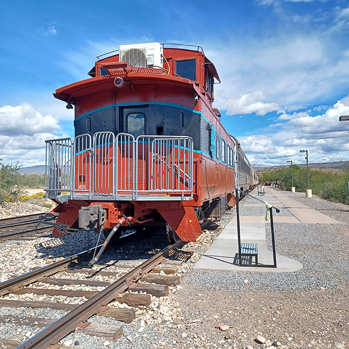 The vintage caboose stands as a cheerful reminder of railroading's golden age, when these red sentinels brought up the rear of every train.