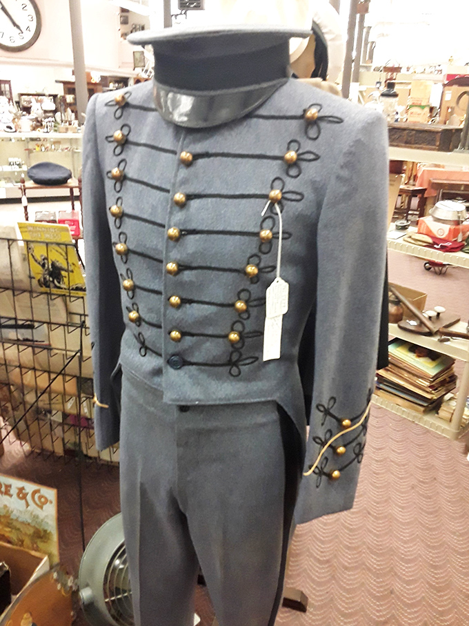 This military uniform stands at attention, brass buttons gleaming with stories of service from another era.