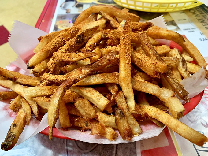 These fries aren't just cooked, they're bronzed to perfection. The seasoning clings to each one like it's afraid of being left behind.