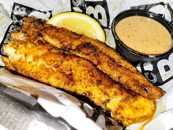 Cajun catfish that's wearing its golden crust like a medal of honor. That remoulade sauce isn't just a condiment—it's a worthy companion.