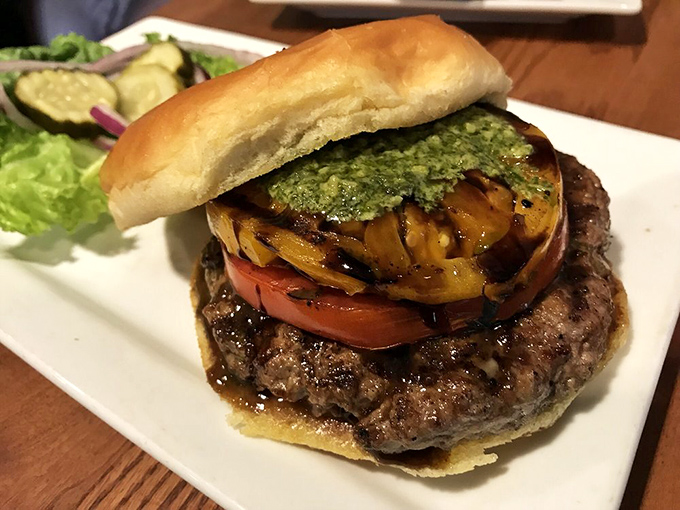 This burger, adorned with grilled pineapple and pesto, is what happens when Italian and American cuisines decide to collaborate rather than compete.