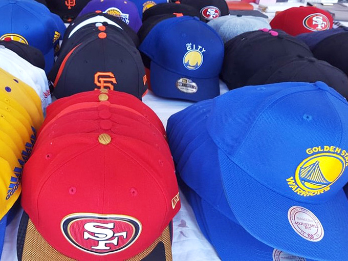 Bay Area sports pride on display! Warriors and 49ers caps showcase local team loyalty, perfect for game days or hiding bad hair situations.