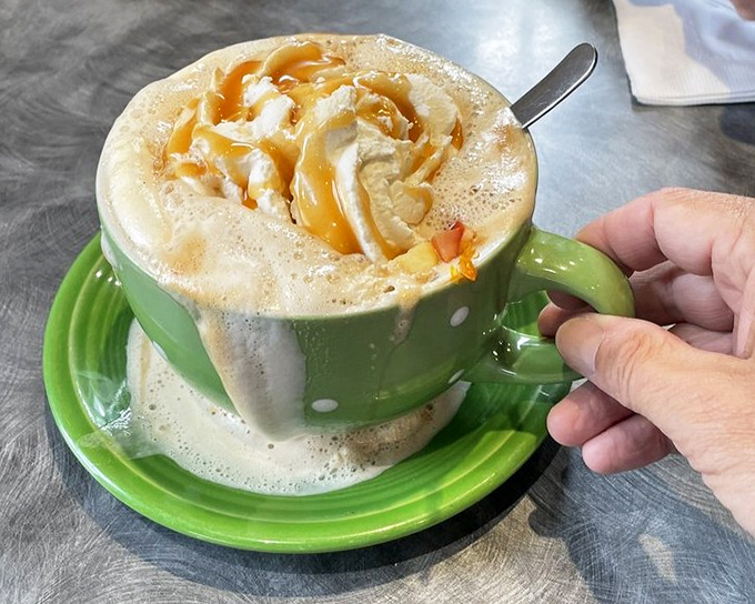 Not just a latte&mdash;it's a warm hug in a polka-dotted mug. The caramel drizzle is writing love poems to the whipped cream.
