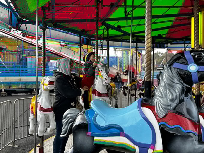 The carousel spins with nostalgic charm, offering parents a moment to rest while children experience the same joy their grandparents once knew.