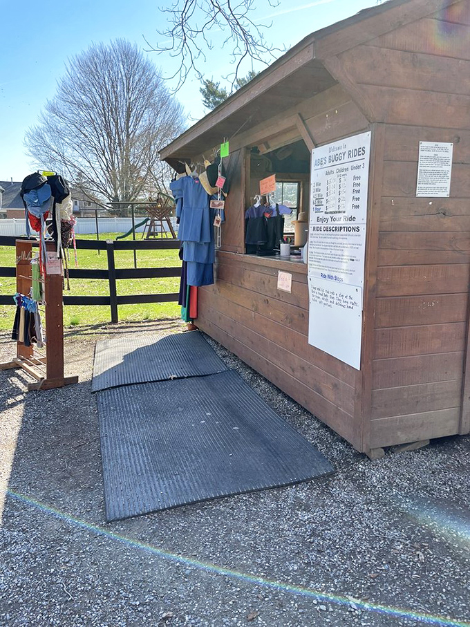 The simple wooden ticket booth offers various ride options, proving that the best adventures don't require complicated booking systems.