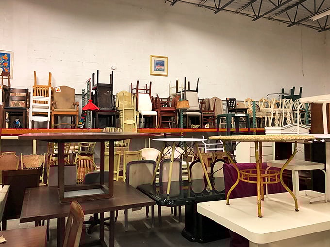 Chair heaven, where every seat has a story. That ladder of dining chairs looks like an evolutionary chart of furniture design through the decades.