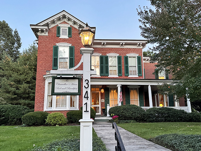 Chancellor's House Bed and Breakfast offers the kind of porch where rocking chairs and evening cocktails create memories that last longer than your Instagram stories.