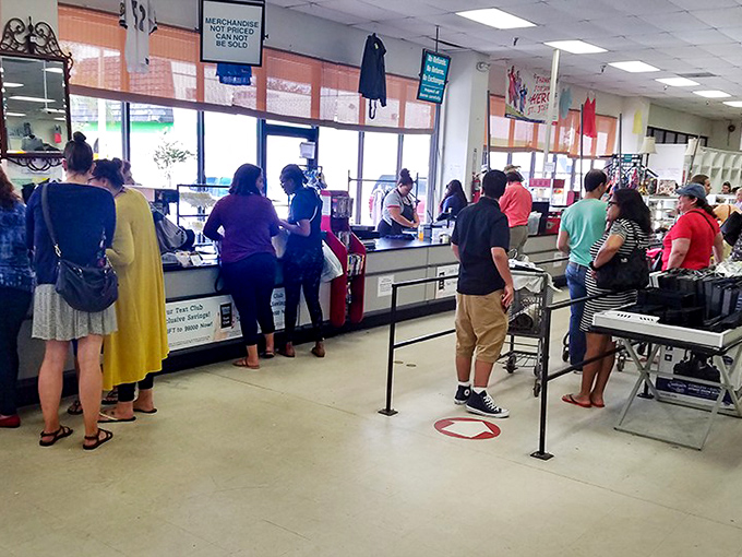 The checkout line: where victory laps are taken and bargain stories are exchanged like trading cards among proud hunters.