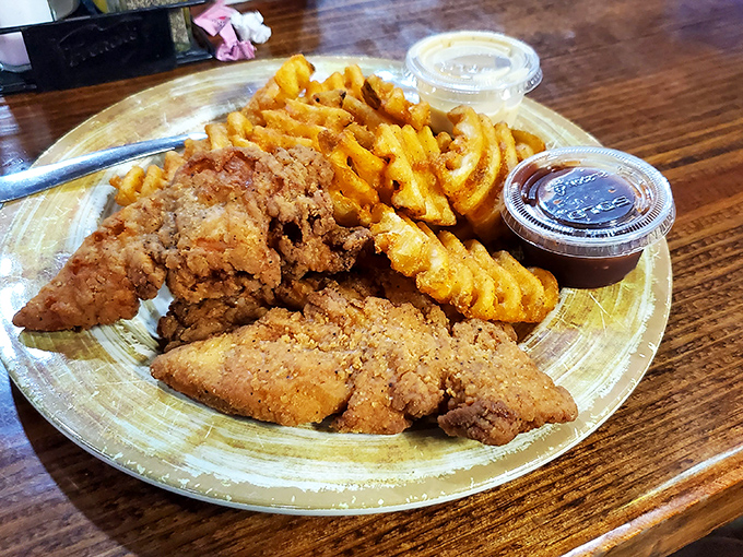 Chicken tenders and waffle fries form an alliance that would make any kid (or adult) ridiculously happy.