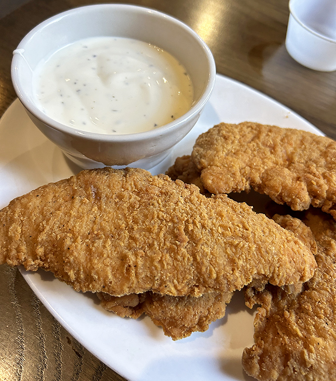Chicken tenders with country gravy remind us that sometimes the simplest preparations deliver the most satisfying results.