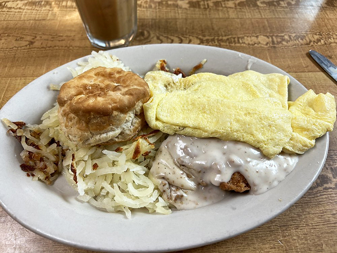 Country-fried comfort on a plate, where gravy isn't just a topping but a warm, peppery blanket for your breakfast.