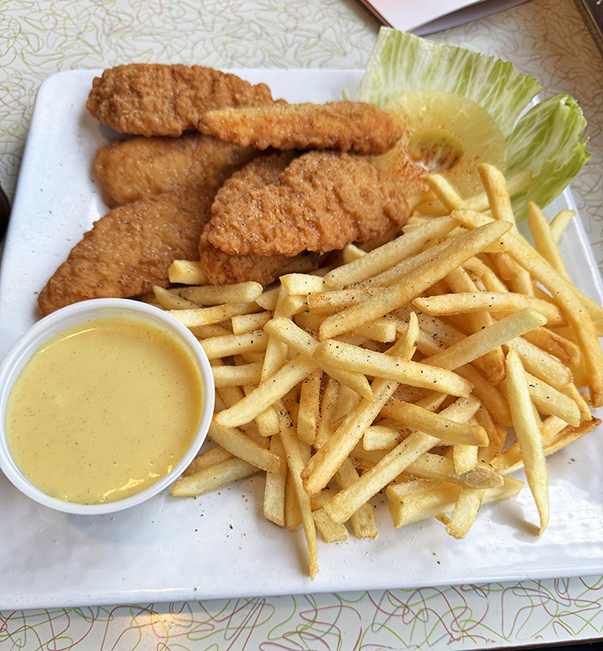 Golden chicken tenders and perfectly crisp fries &ndash; comfort food that speaks the universal language of "everything's gonna be alright."
