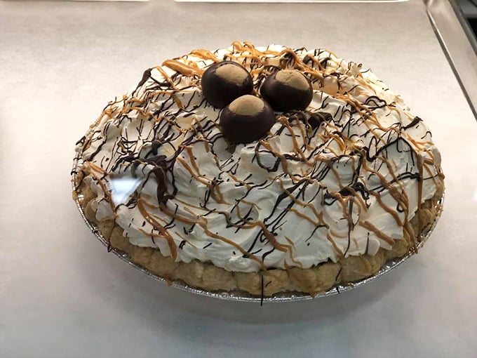 This isn't just pie &ndash; it's a cloud of whipped cream artistry topped with chocolate-dipped treasures that would make Grandma both proud and jealous.